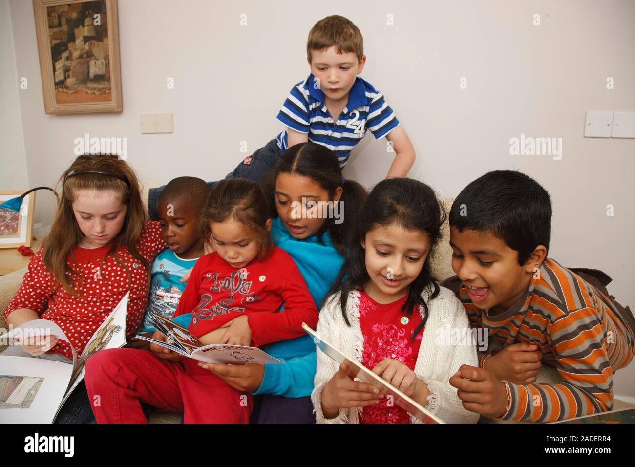 Group of children reading Stock Photo - Alamy