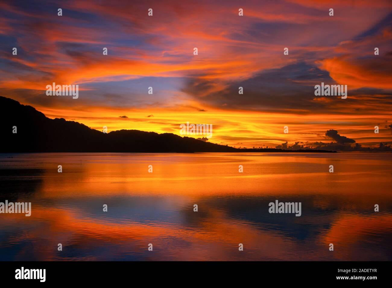 Golden sky with clouds at sunset, U district, Pohnpei, Federated States ...