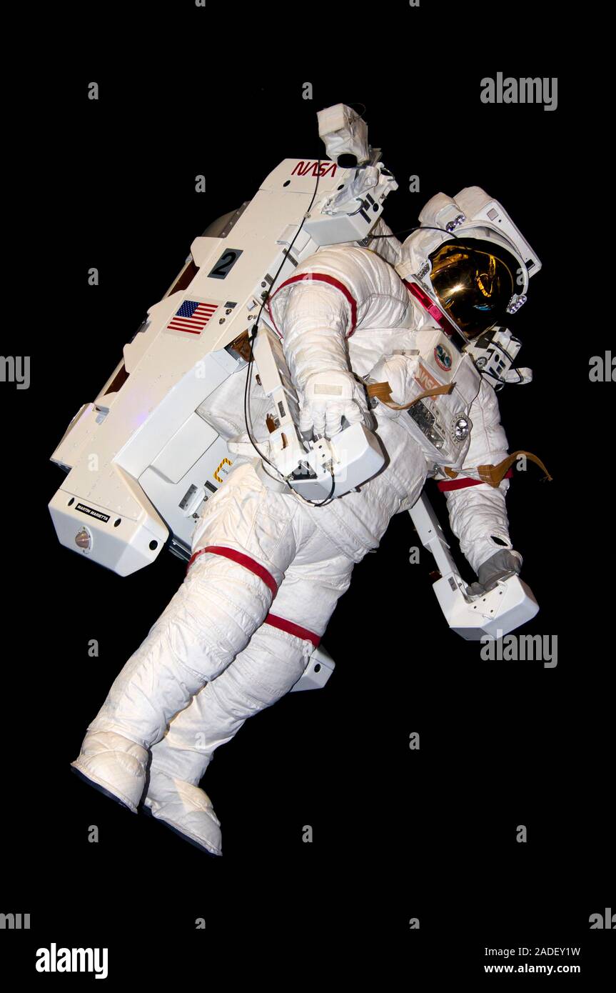 A Space Shuttle astronaut's spacesuit attached to a Manned Maneuvering ...