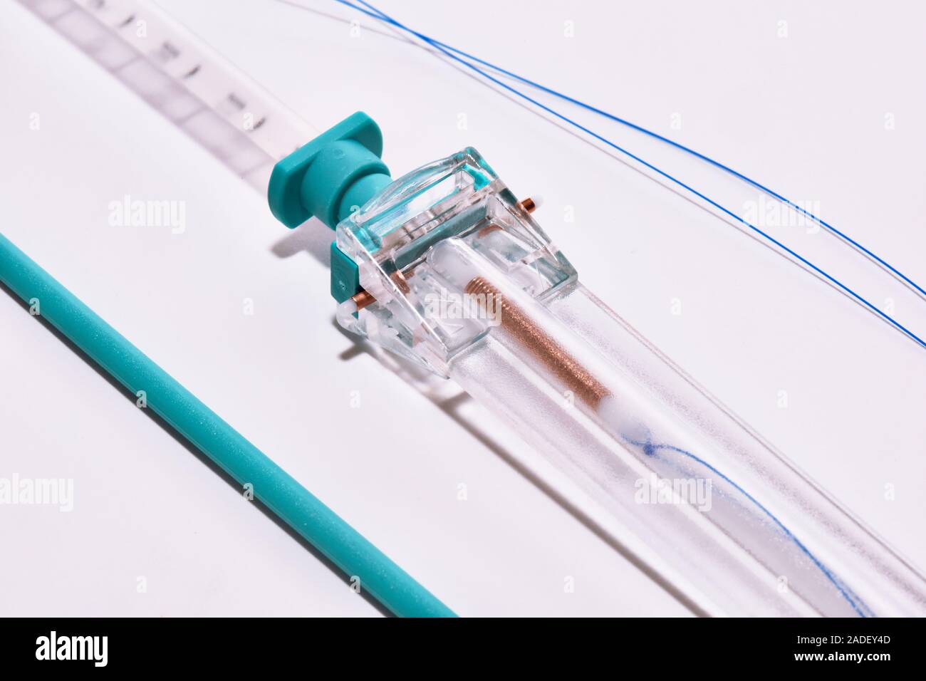 Contraceptive coil. Close-up of a slimline intrauterine device (IUD ...