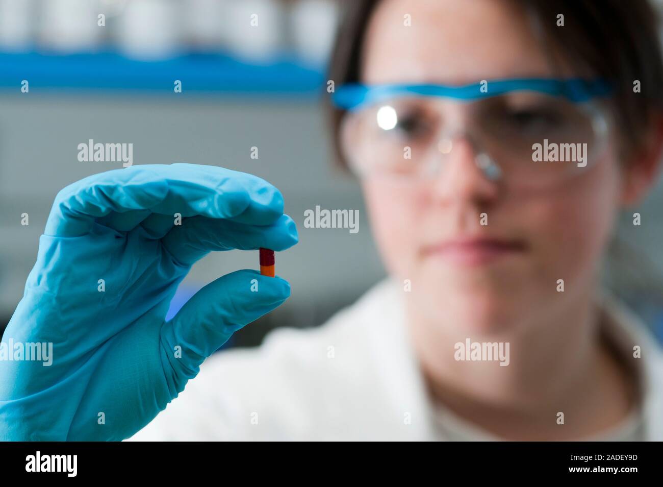 Pharmaceutical research. Researcher handling drugs in a laboratory ...
