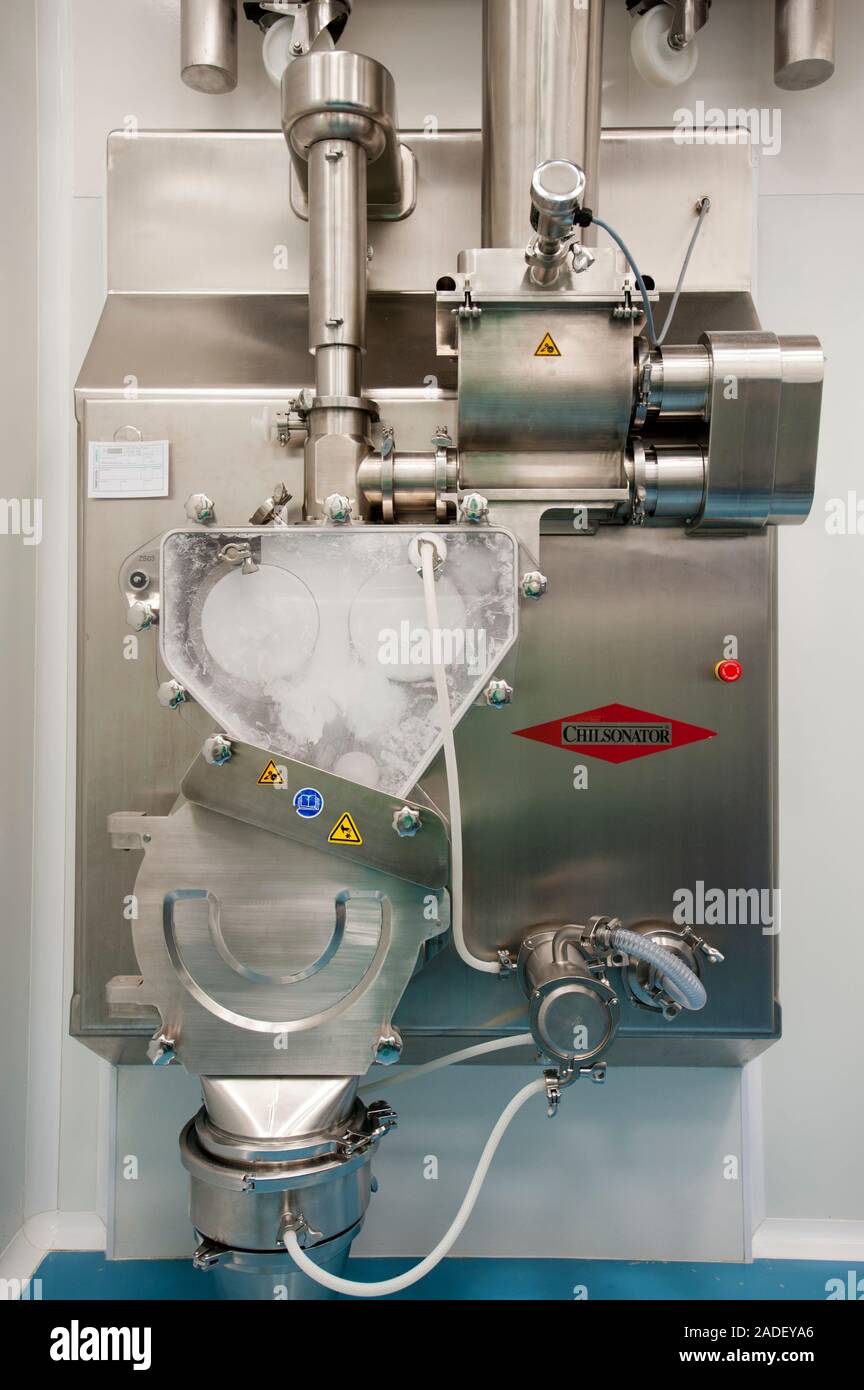 Pharmaceutical drug production. Machine being used to produce drugs ...