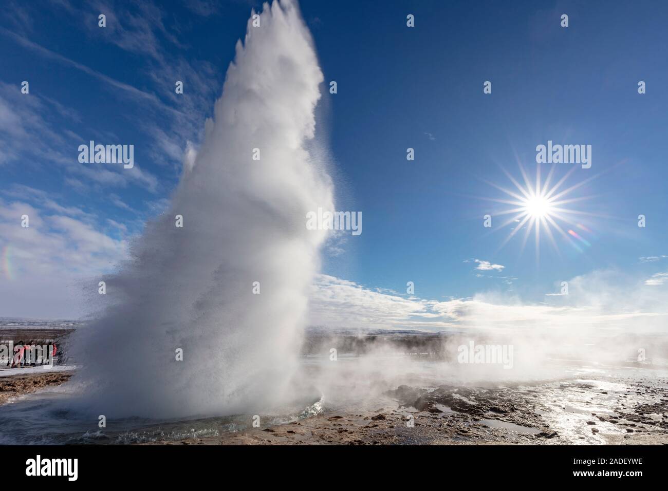 Strokkur Geyser erupting. A geyser is a deep natural well in a ...