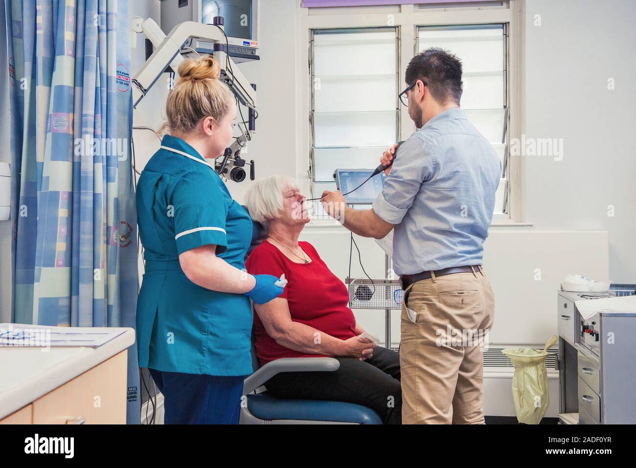 MODEL RELEASED. Nasal endoscopy. Patient being examined by a doctor at ...