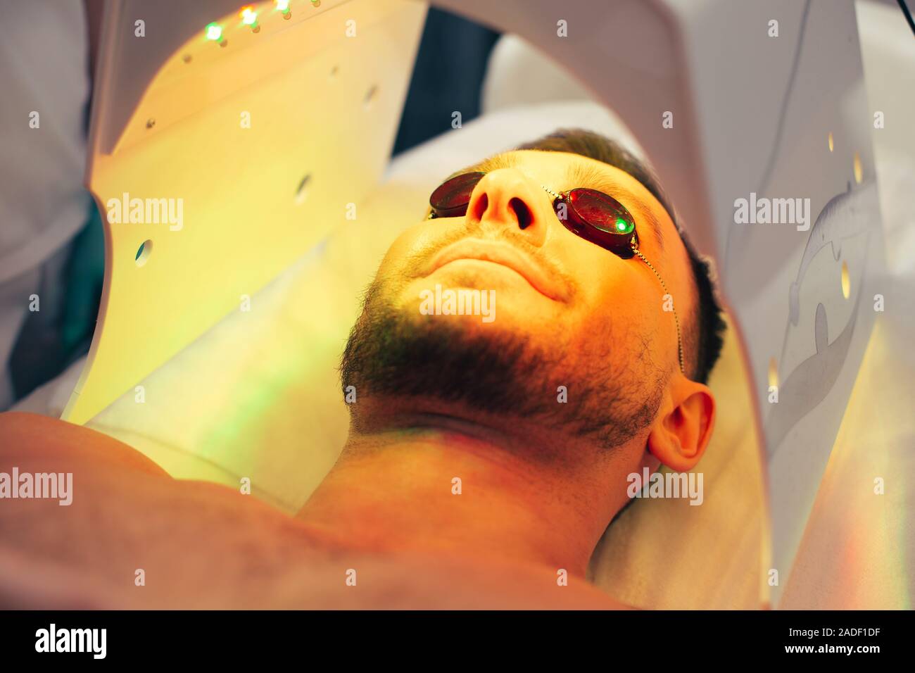 Bearded man smiling in the modern solarium Stock Photo - Alamy
