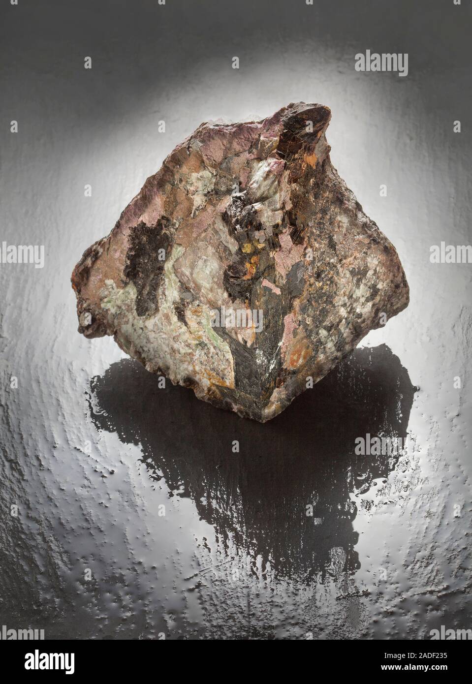A very coarse grained rock called a pegmatite. This specimen is from ...