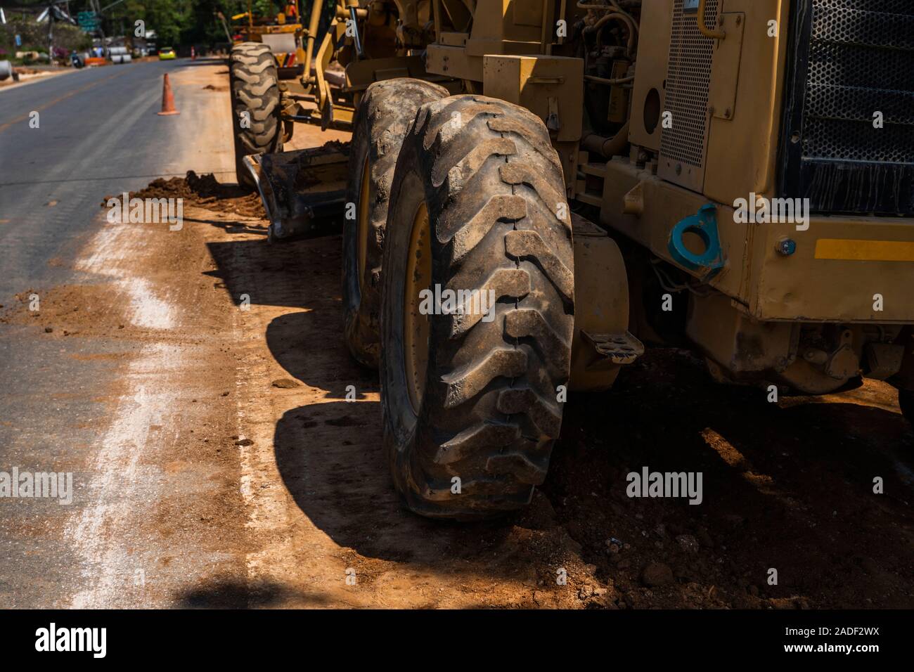 Details of grader is working on road construction. Grader industrial ...