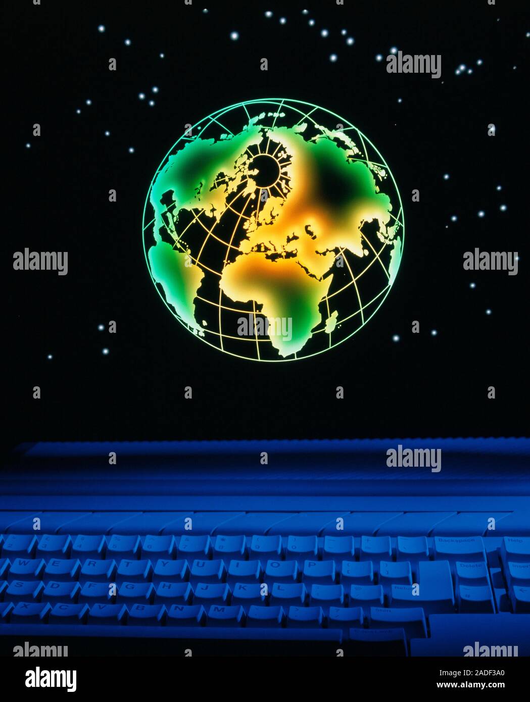 Abstract composite image of Earth placed over a computer keyboard ...