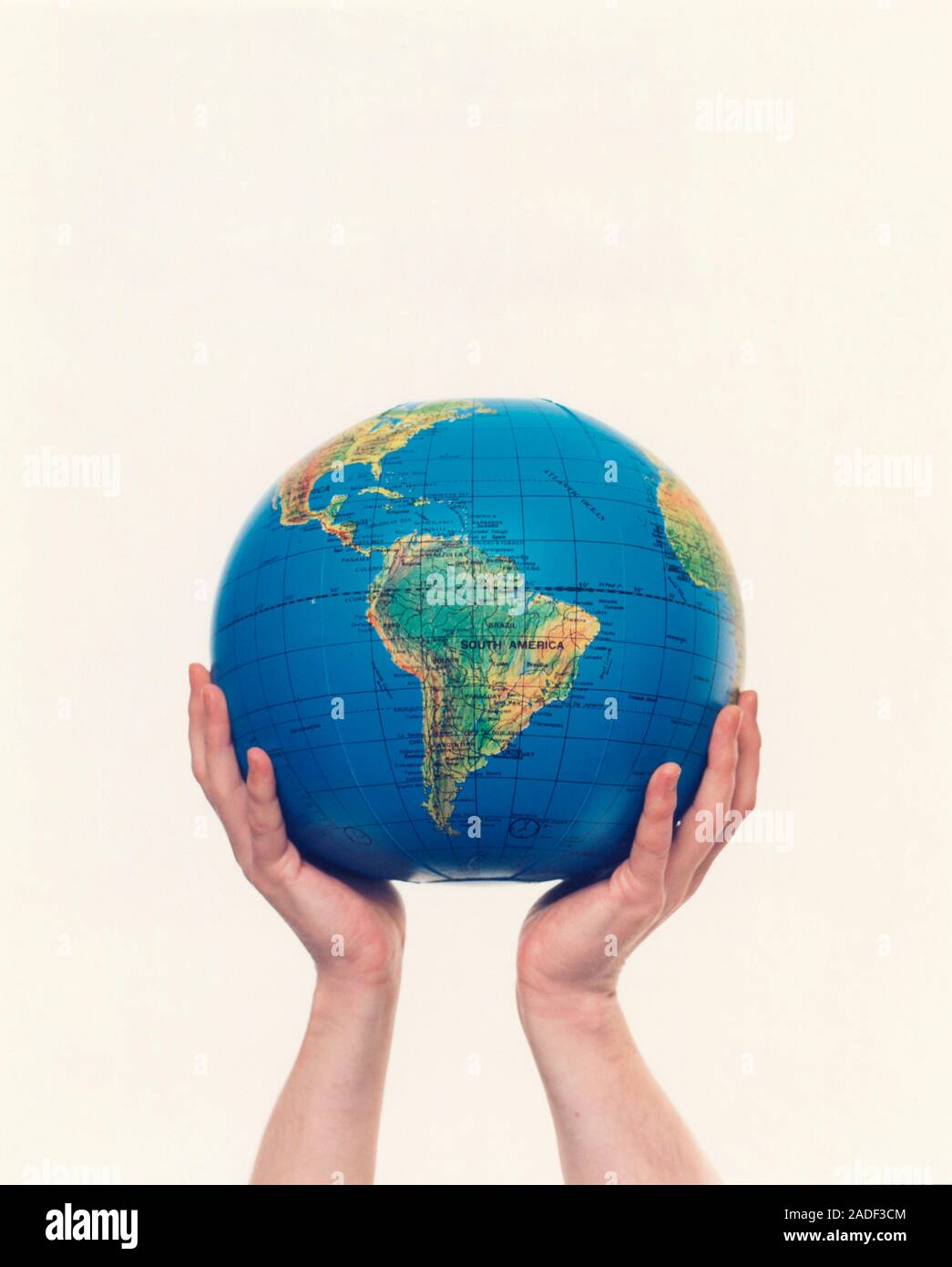 Inflated globe. Hands supporting an inflated Earth globe Stock Photo ...