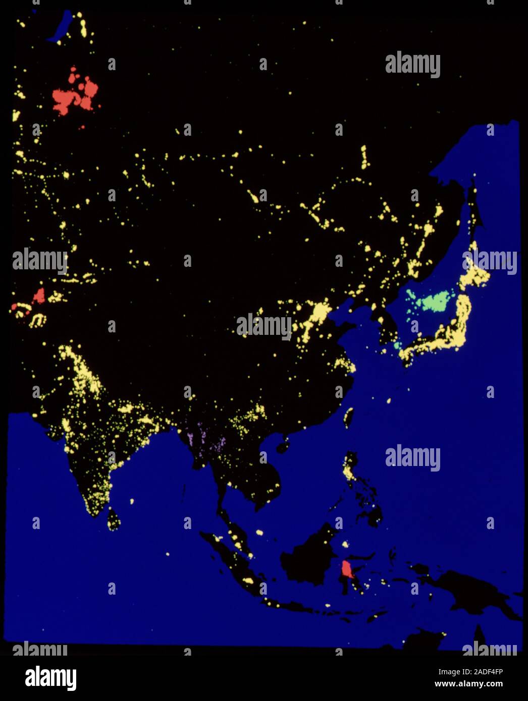 Asia at night from space. Colour-coded satellite image of Asia at night ...