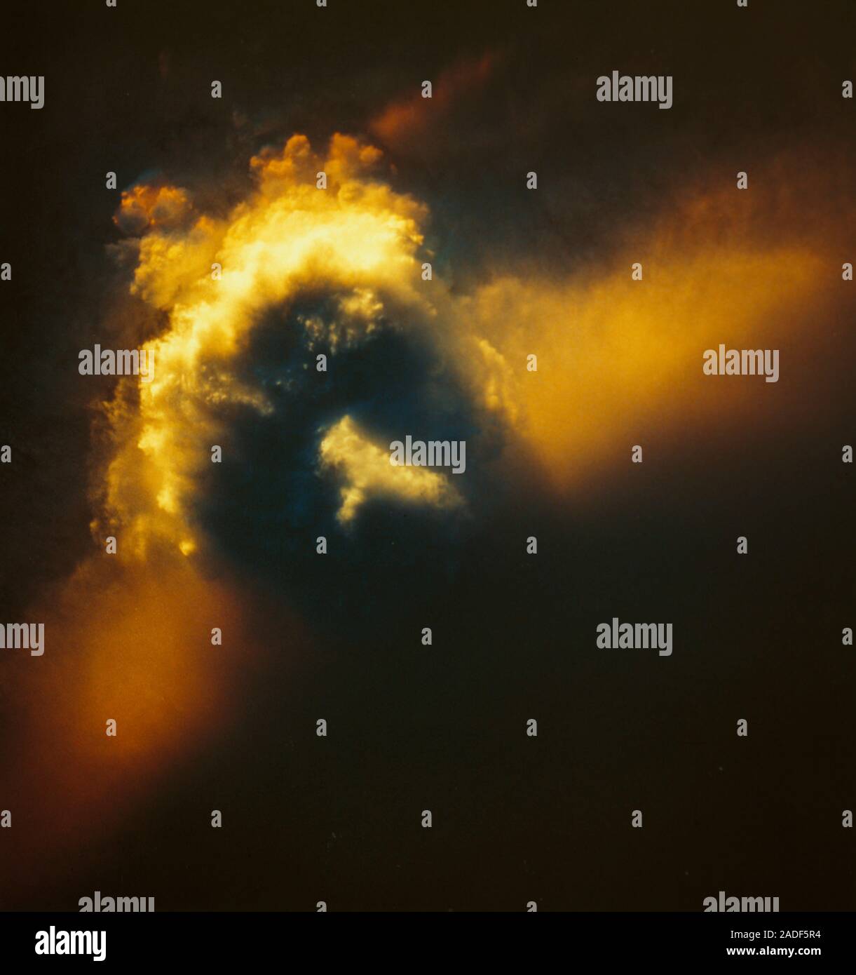 Photograph of a thundercloud illuminated from within by a flash of ...