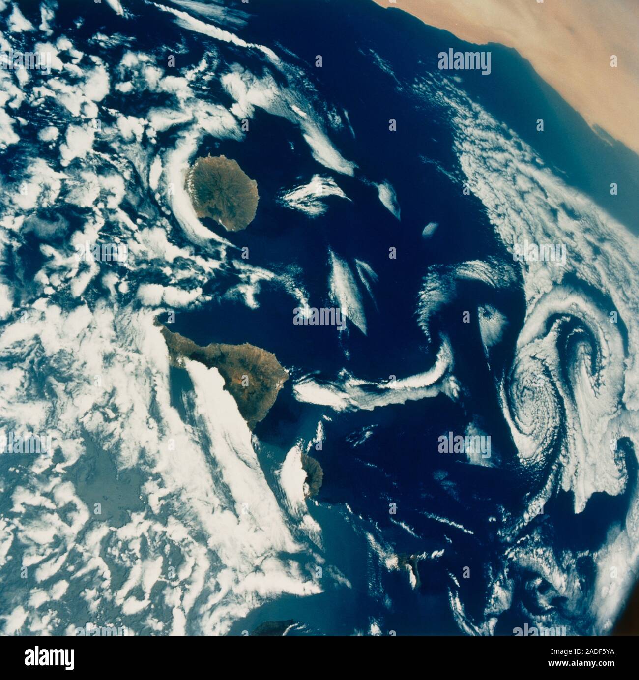 Swirls of low-level stratus clouds over the Canary Islands, seen from ...