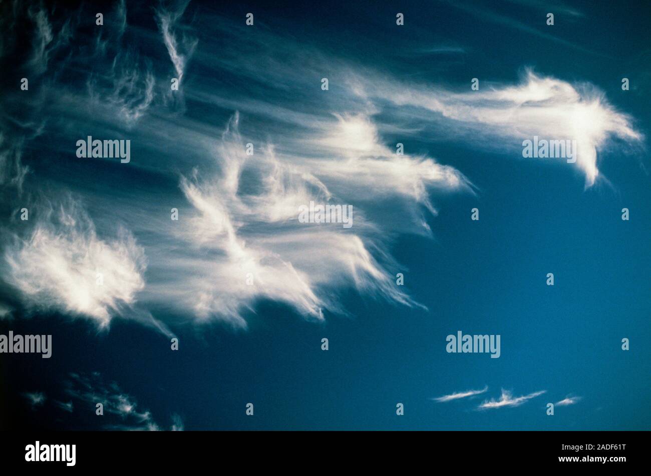 Cirrus cloud. Wisps of cirrus cloud in the sky. Depending on their ...