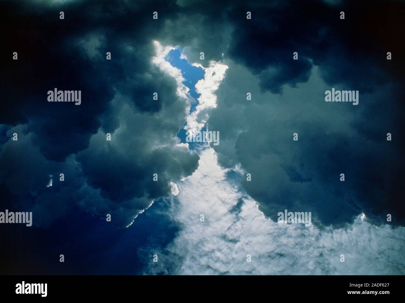 Cumulus clouds. Dark cumulus clouds seen from be- low. Cumulus clouds ...