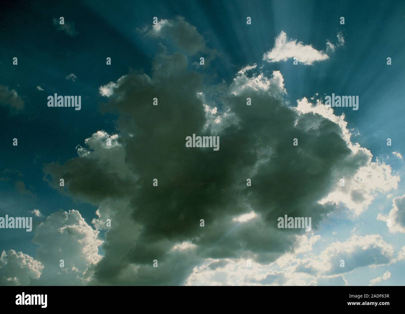 Sun rays. View of a large cumuliform cloud showing rays of sunlight ...