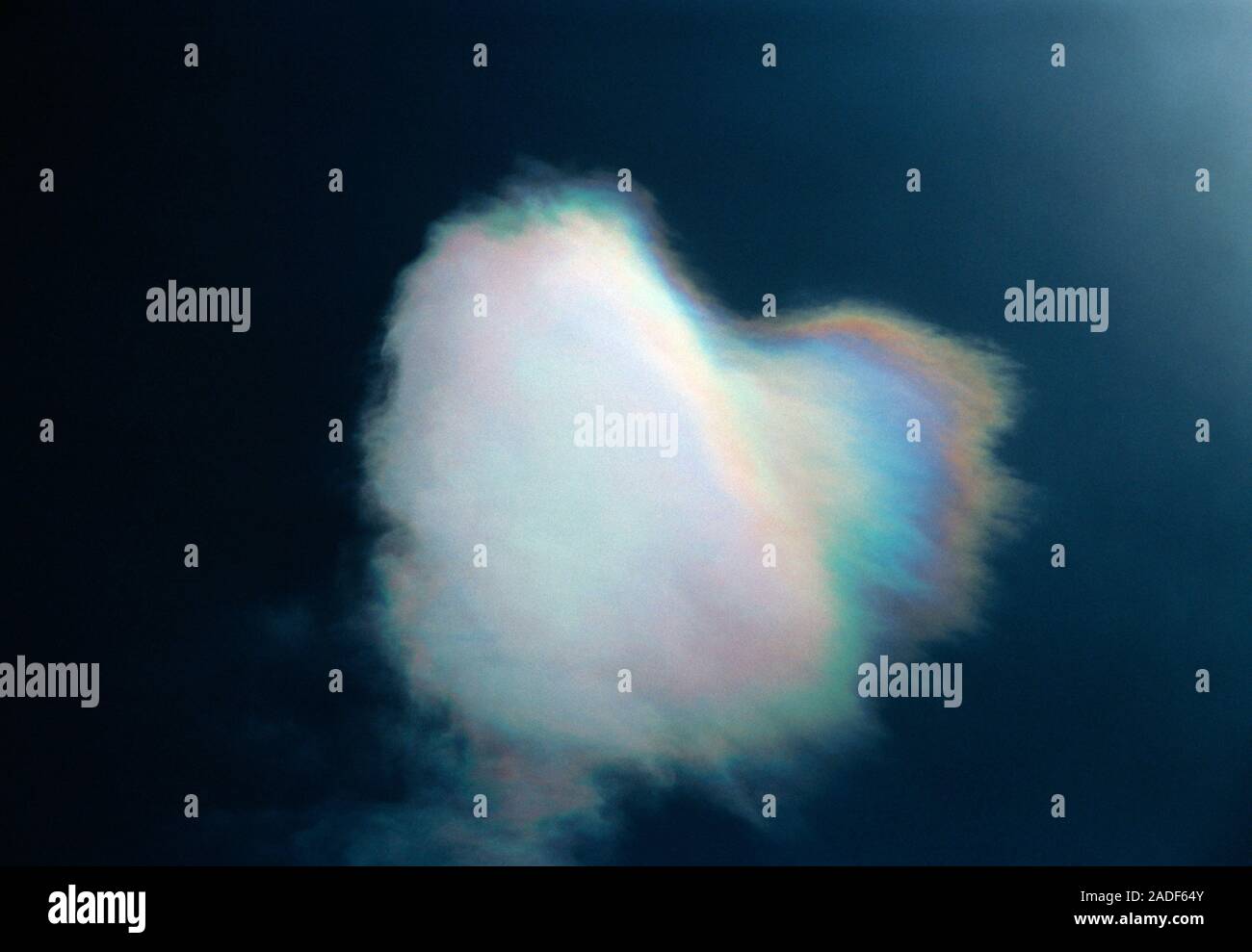 Iridescent cloud. Tiny cloud particles have refracted the sunlight ...