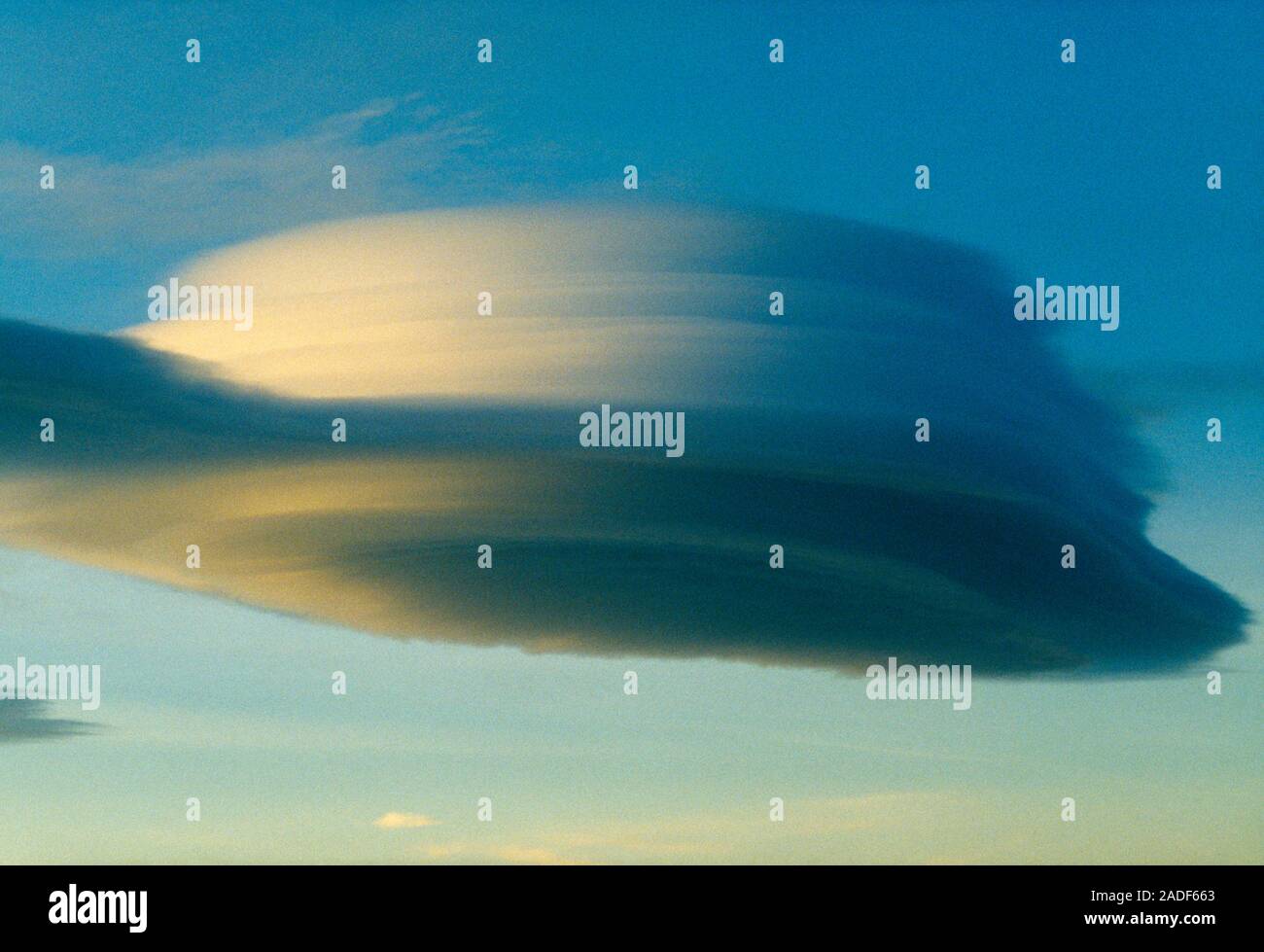 Lenticular cloud. This cloud is seen over mountains and mountain ranges ...