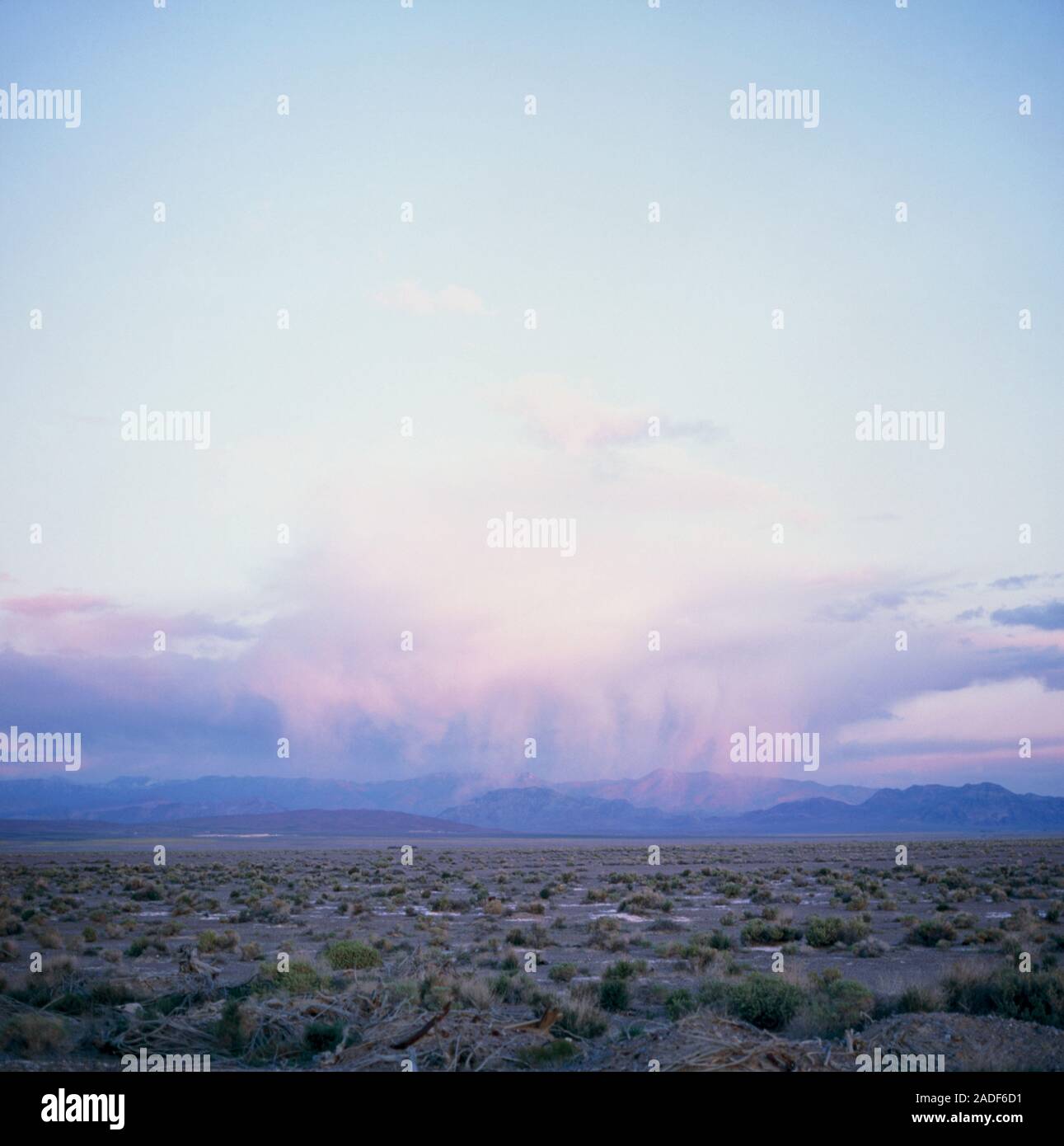 Rainfall. View of distant rainfall in a desert. The shower can be seen ...