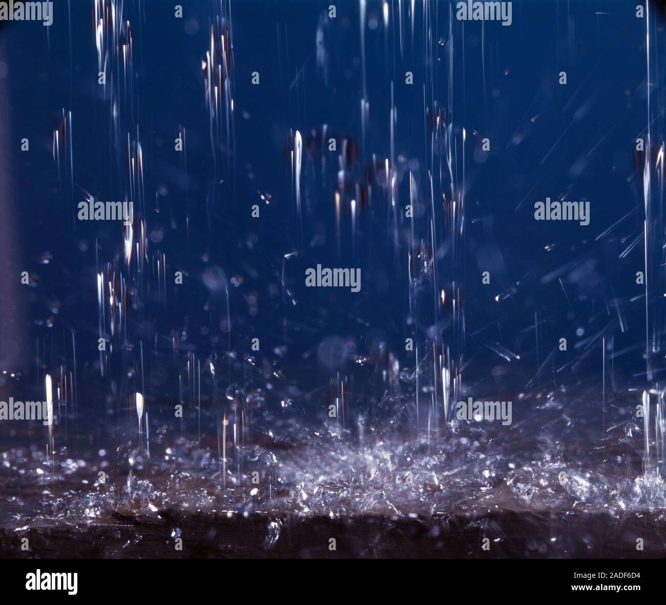 Rainfall. Rain splashing on a surface Stock Photo - Alamy