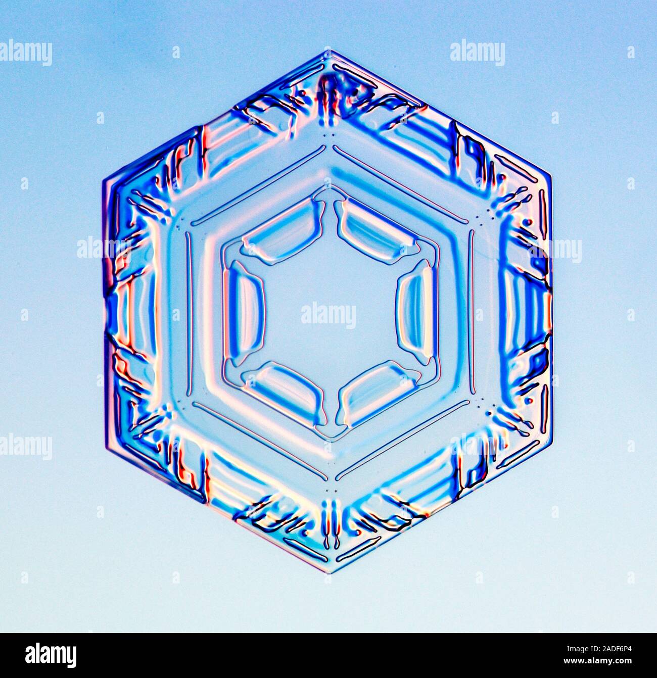 Hexagonal snowflake. Snowflakes are ice crystals that form in air that ...