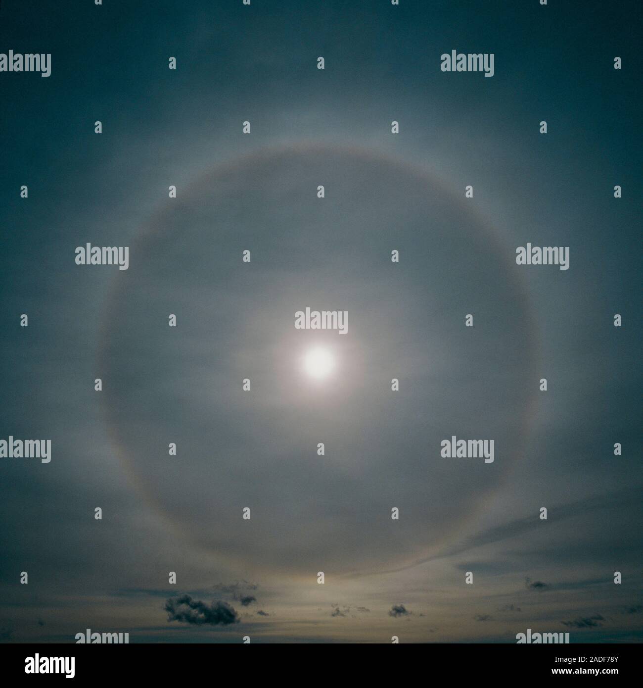 Photograph of a twenty two degree diameter ice halo around the Sun. The ...