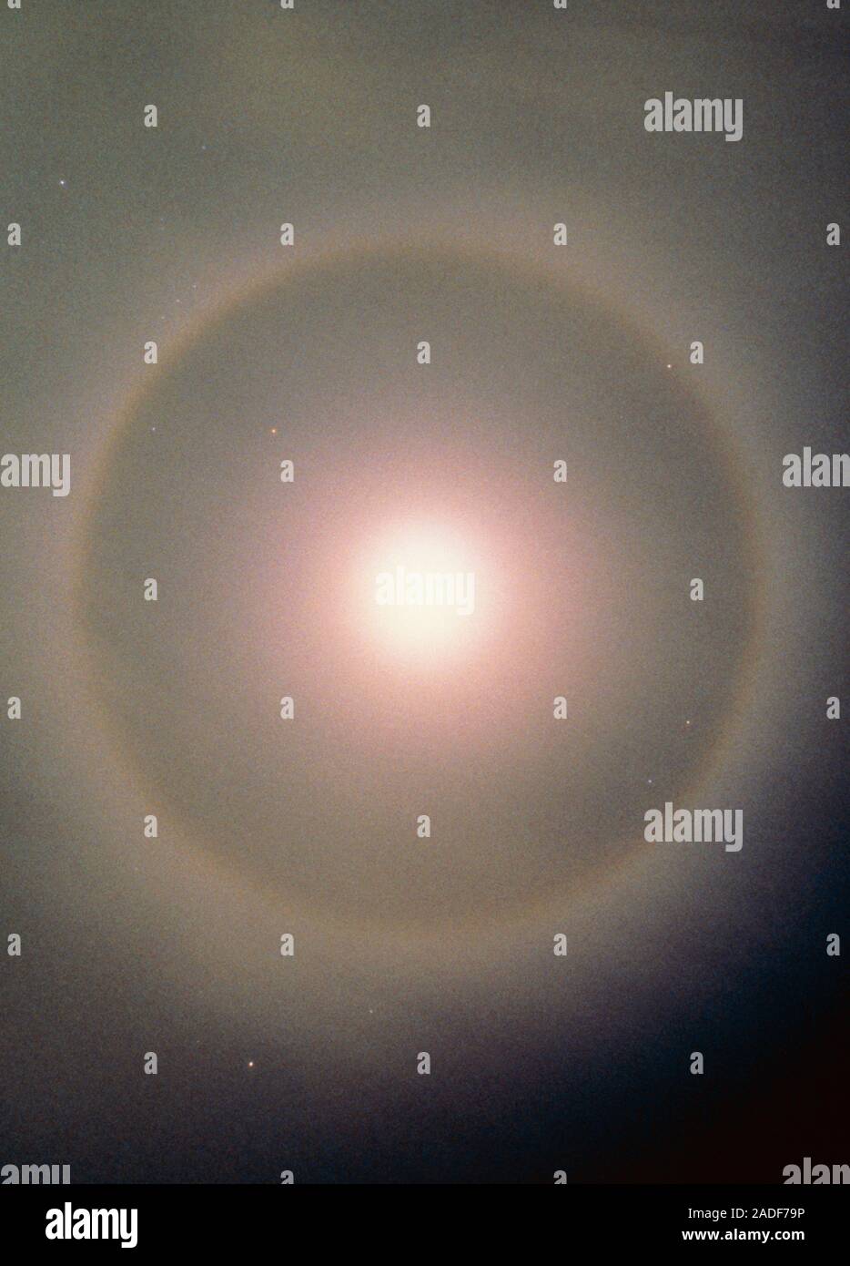 Moon halo. High cirrus clouds create a circular halo around the moon ...