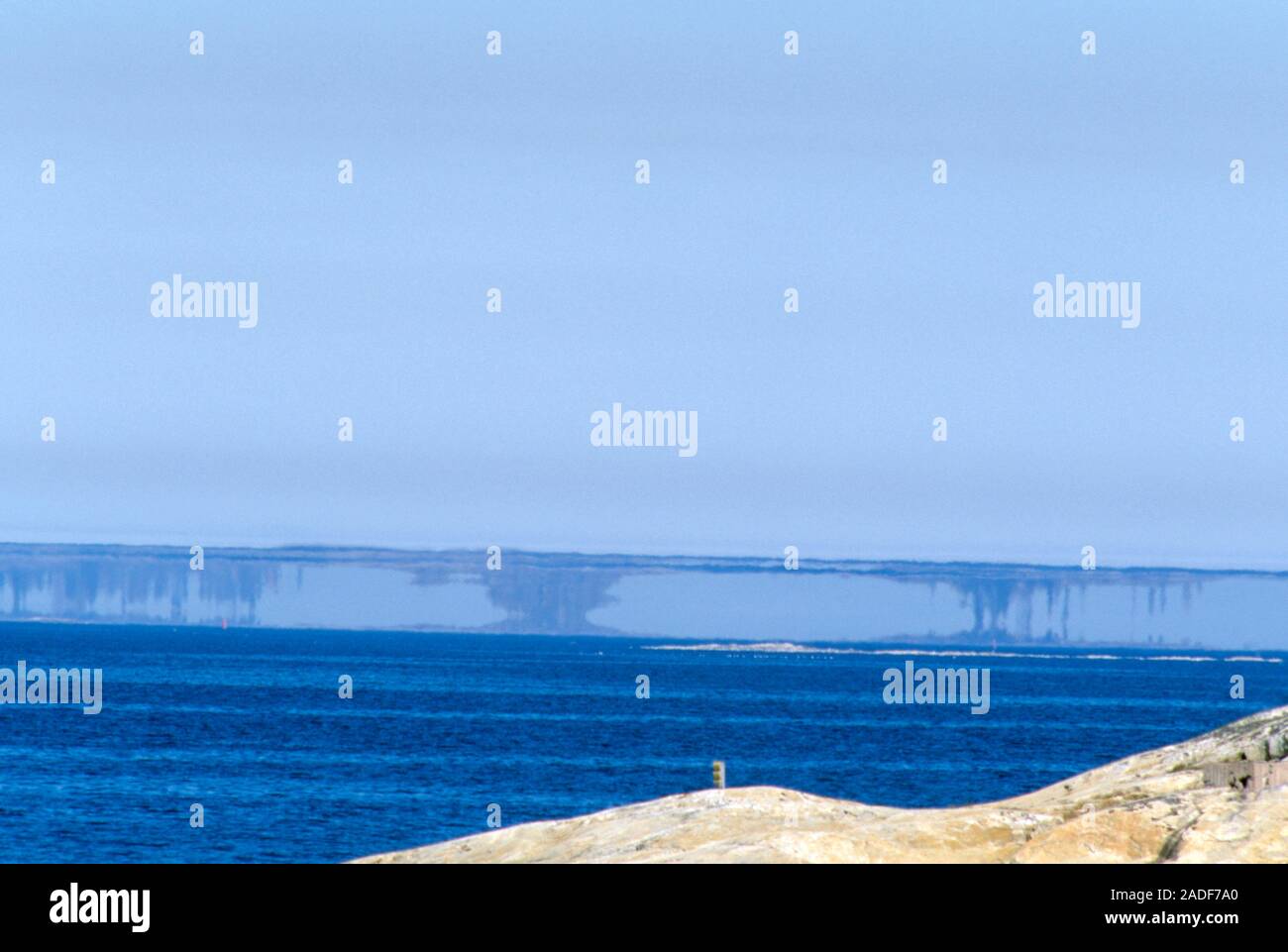 Mirage. The double inverted image seen above the horizon is caused by ...