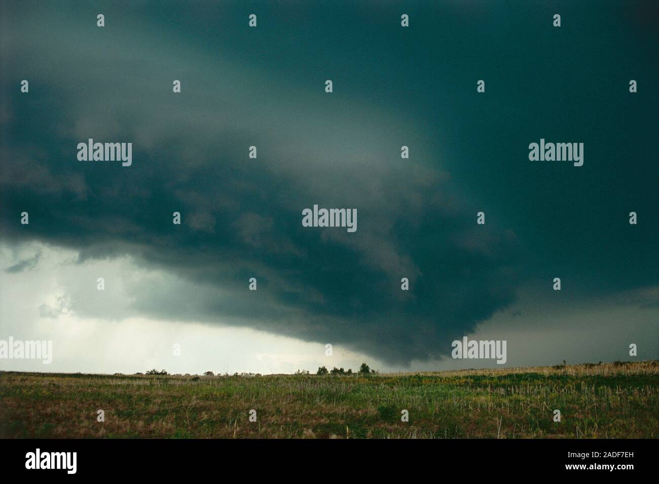Supercell thunderstorm over farmland. A supercell thunderstorm is a ...