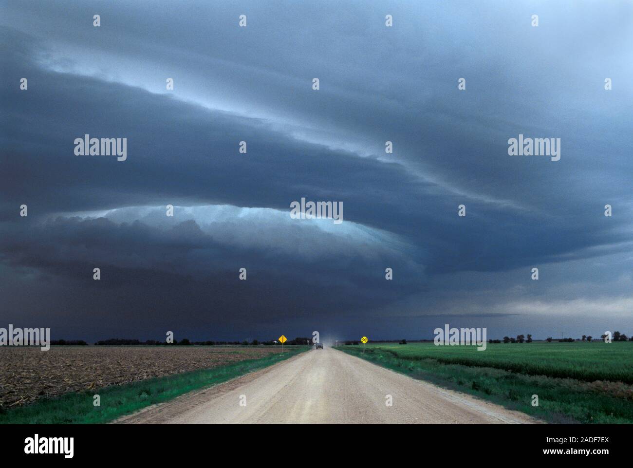Supercell thunderstorm over farmland. A supercell thunderstorm is a ...