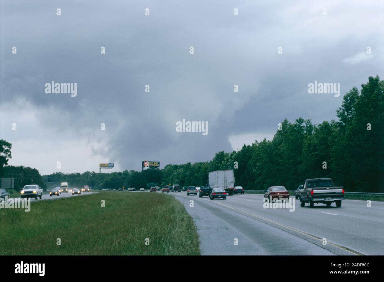 Tornadic supercell thunderstorm over a motorway. A supercell ...