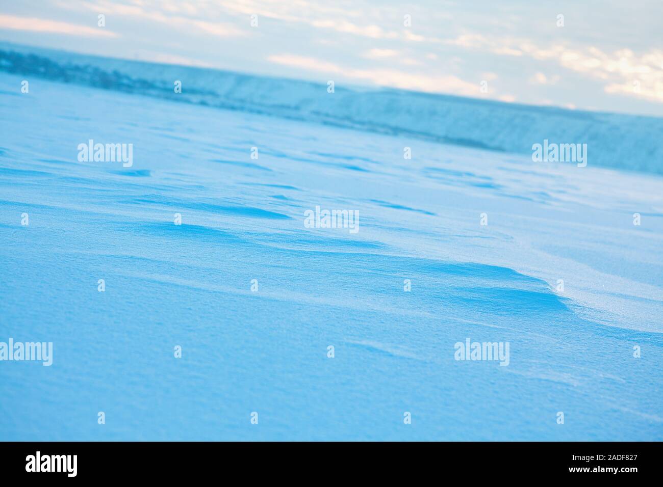 winter landscape with snowdrift on the frozen surface Stock Photo - Alamy