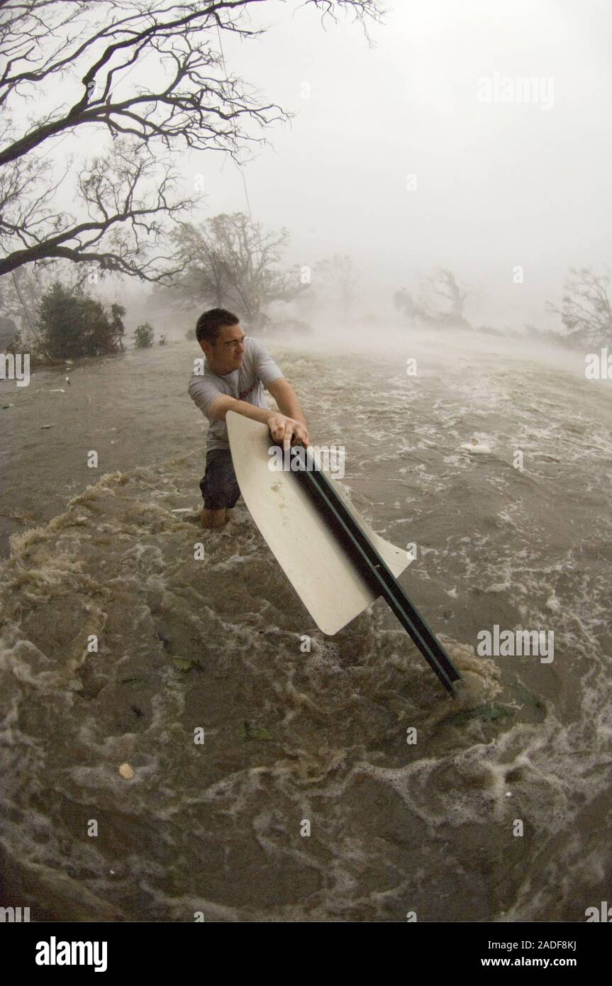 Man battling hurricane Katrina. Professional storm photographer ...