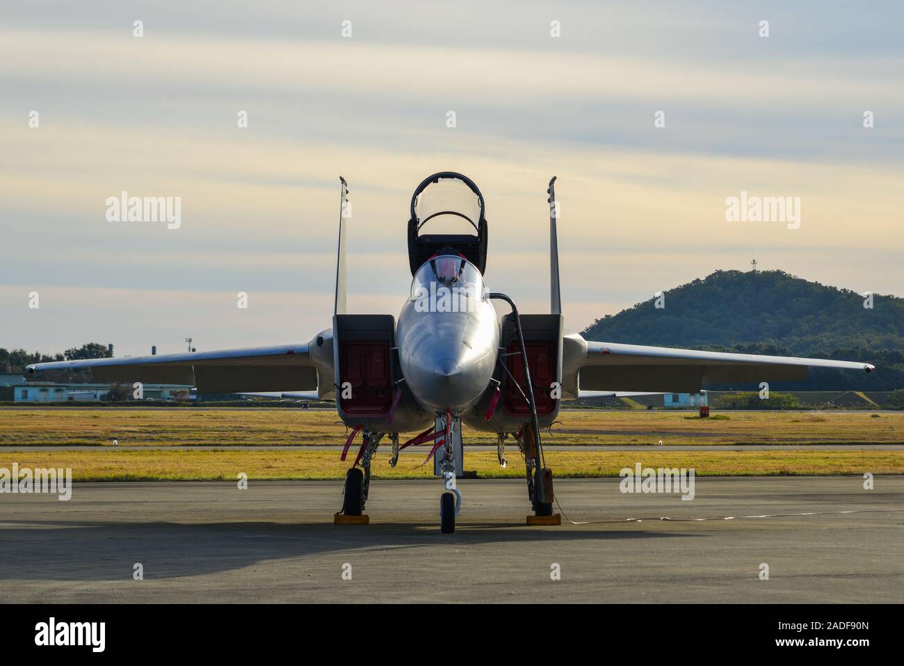 Fighter jet taxiing on runway of air base in sunny day Stock Photo - Alamy