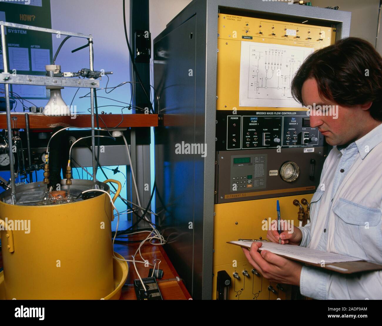 Air analysis. Scientist notes the level of carbon dioxide gas in a ...