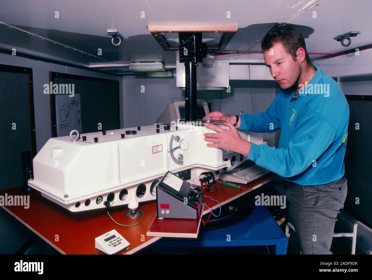 Ozone measurement. Scientist taking readings from a Dobson ...