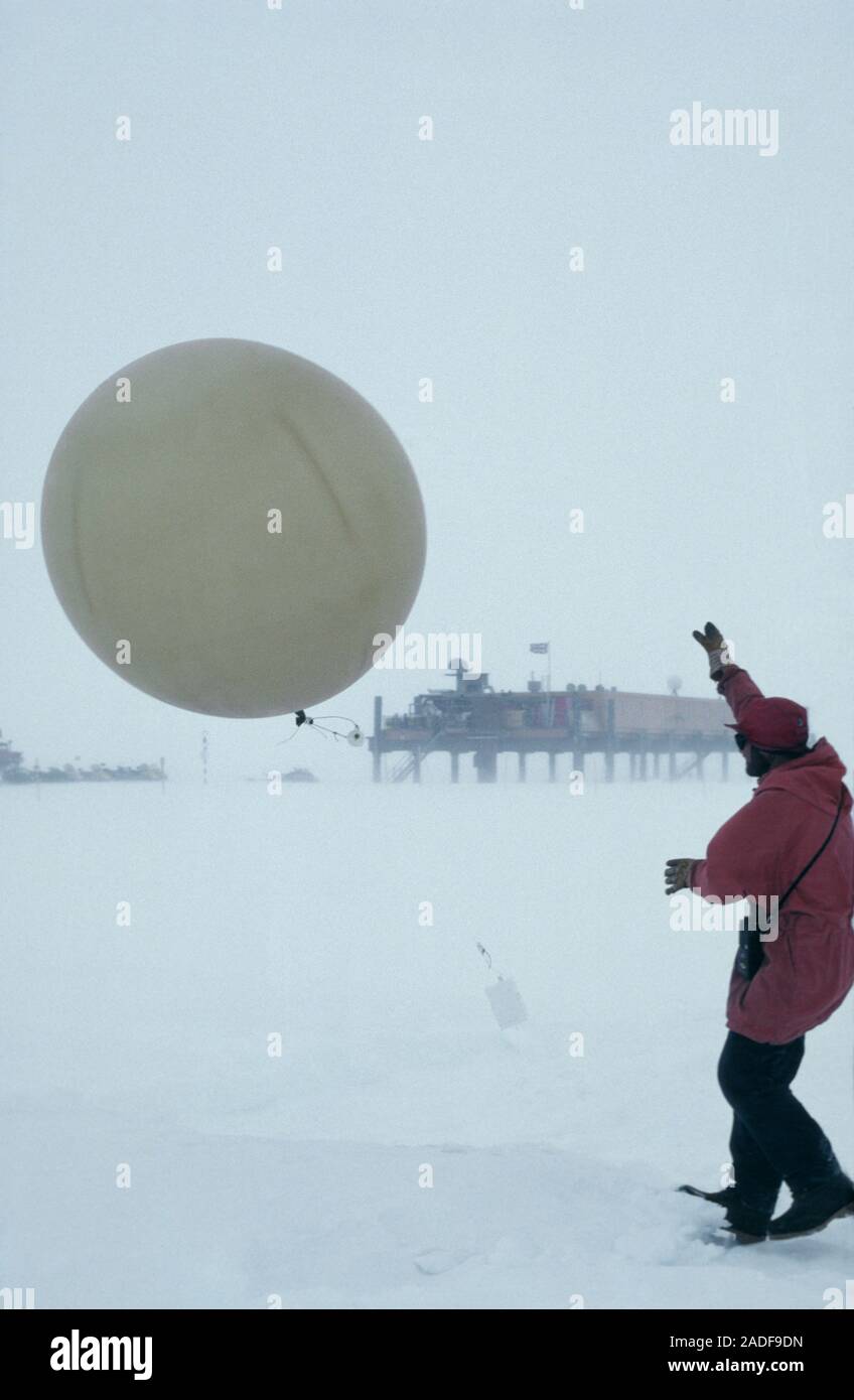 Weather balloon launch. Researcher launching a radiosonde weather ...