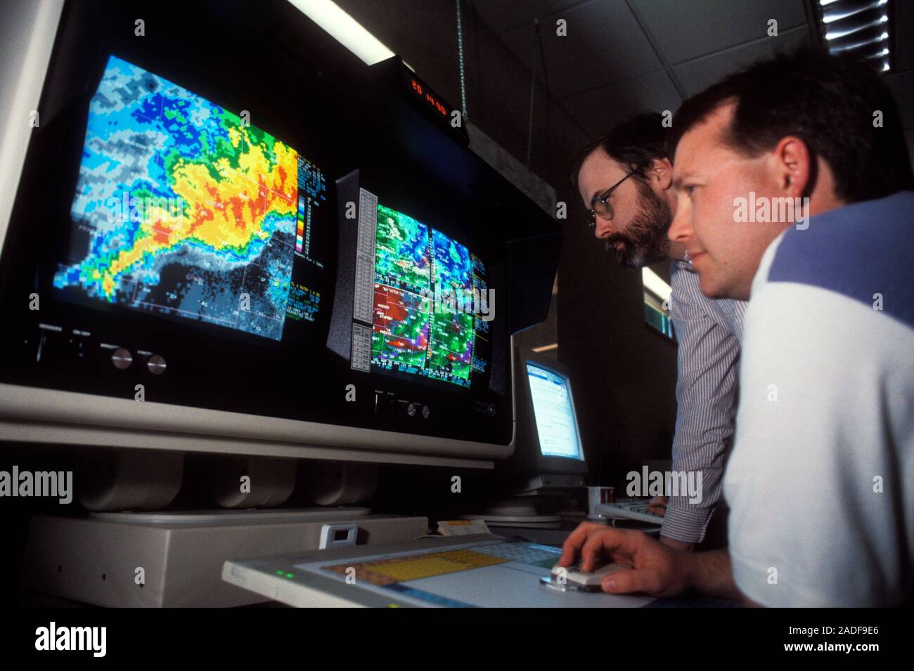 Weather forecasting. Meteorologists monitoring the progress of a severe ...