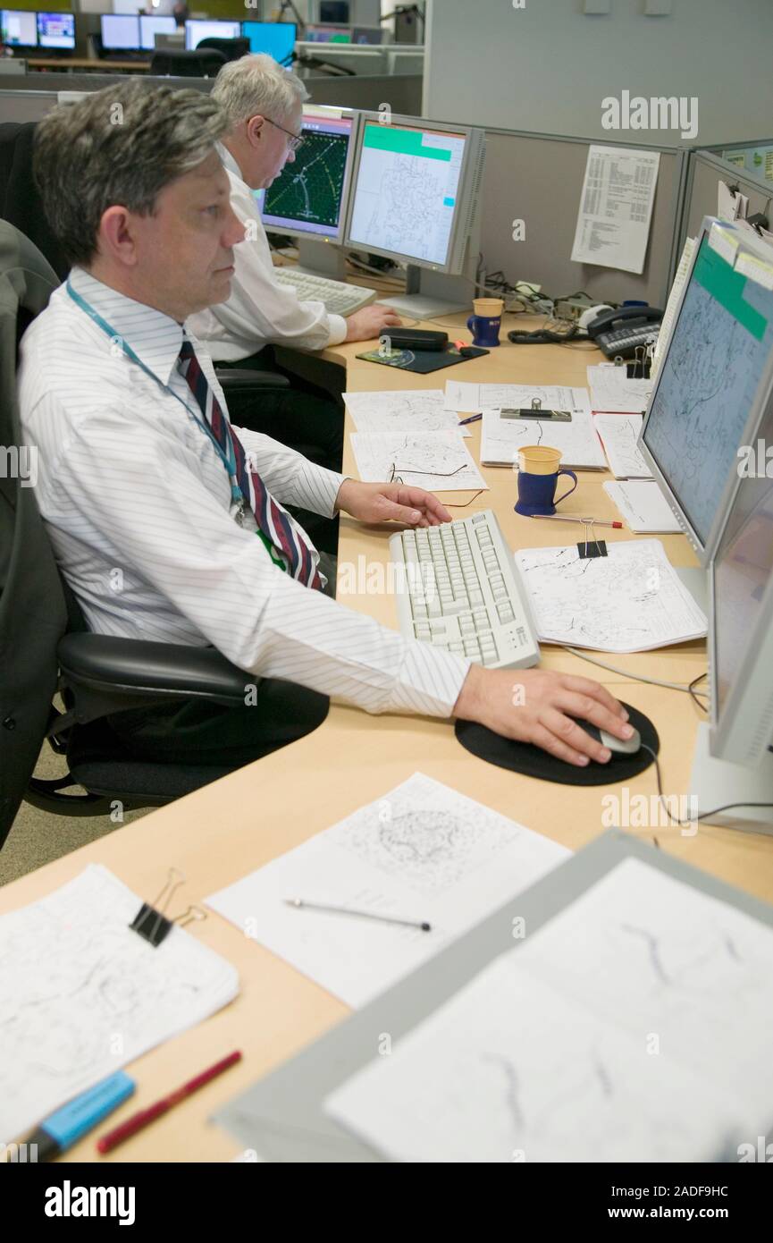 MODEL RELEASED. Weather forecasting. Meteorologists forecasting the ...