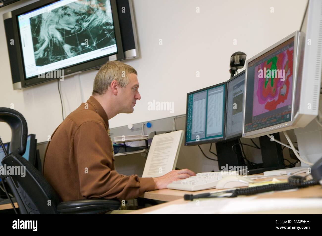 MODEL RELEASED. Weather forecasting. Meteorologist forecasting the ...