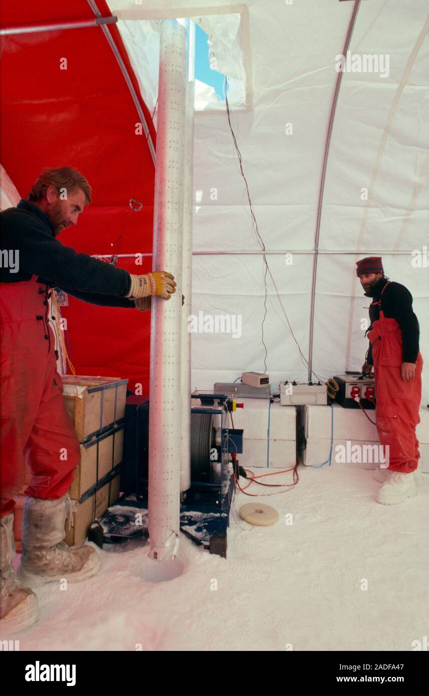 Climate change research. Atmospheric scientists lining up an ice core ...