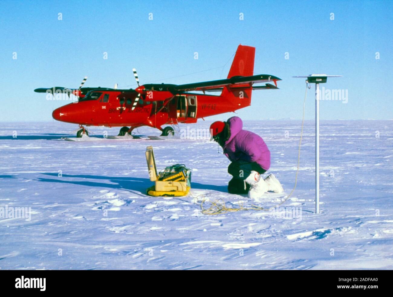 Measuring glacier speed. Glaciologist uses a Global Positioning System ...