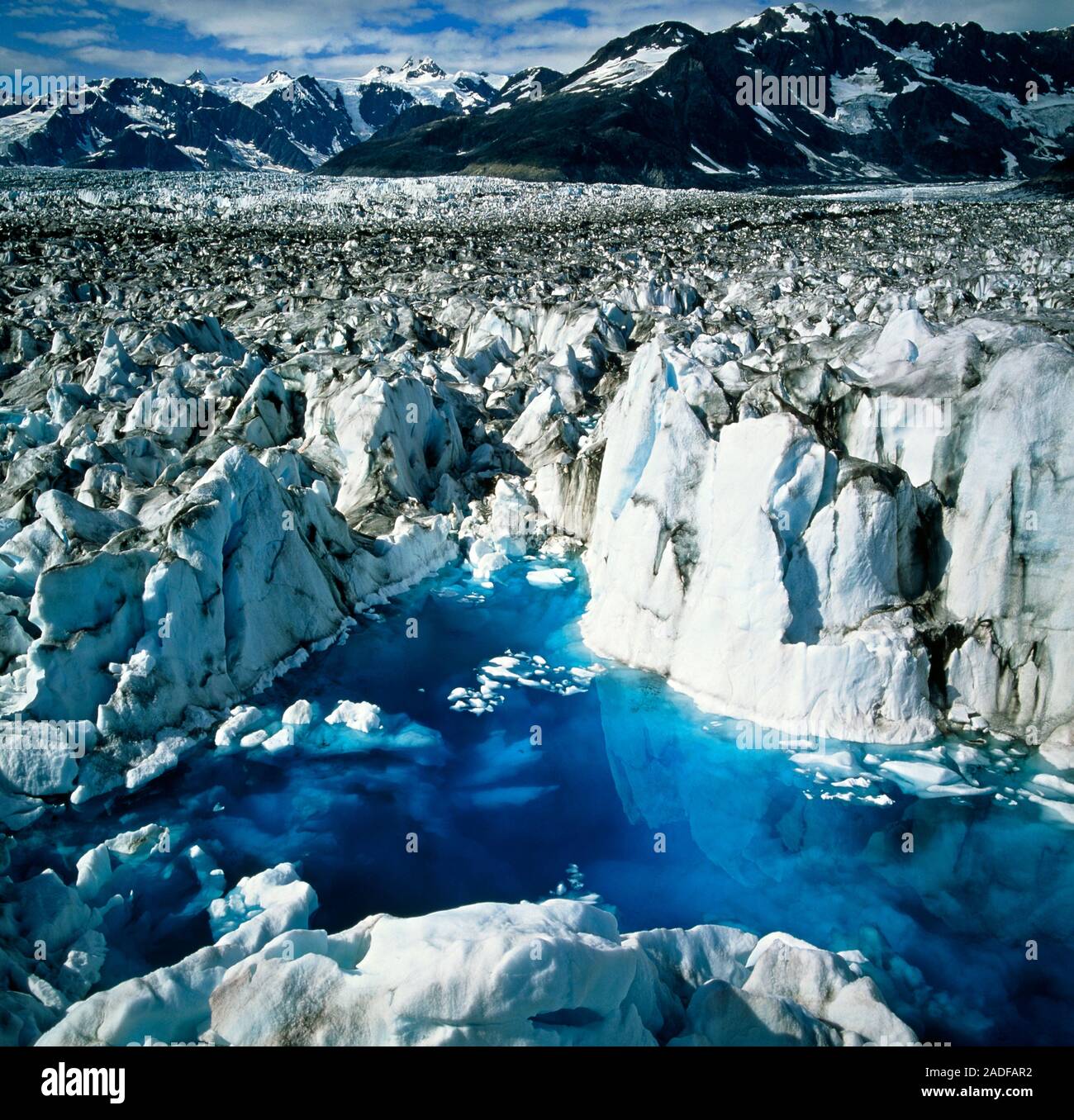 Meltwater on glacier. View of meltwater nearly filling a large crevasse ...