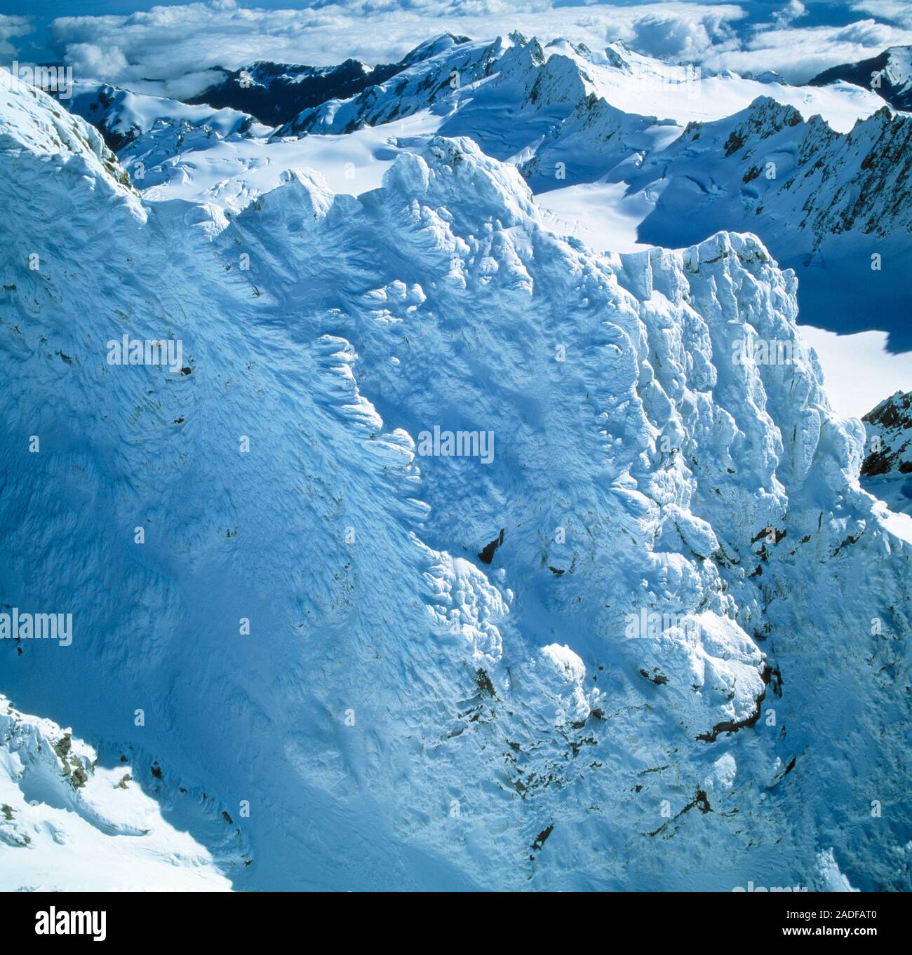 Glaciated rock face. Glaciers are formed when snow falls on high ground ...