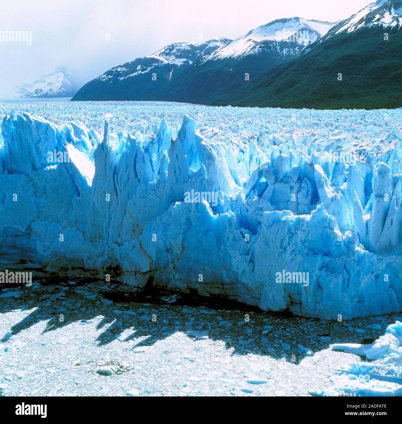 Glacier. Ice pinnacles at the front of a glacier as it reaches the sea ...