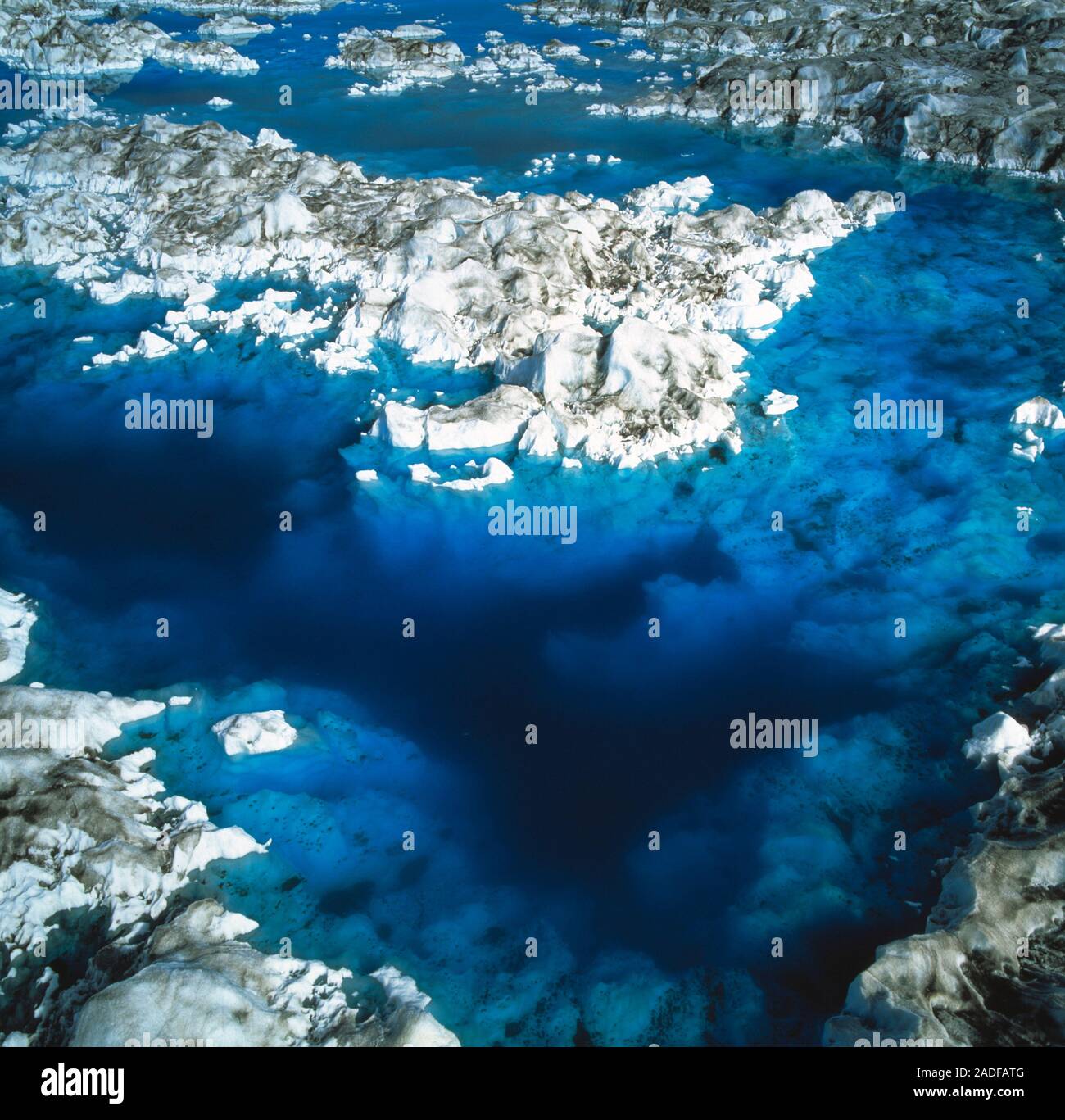 Melt water pond. Aerial view of a melt water pond on a glacier, formed ...