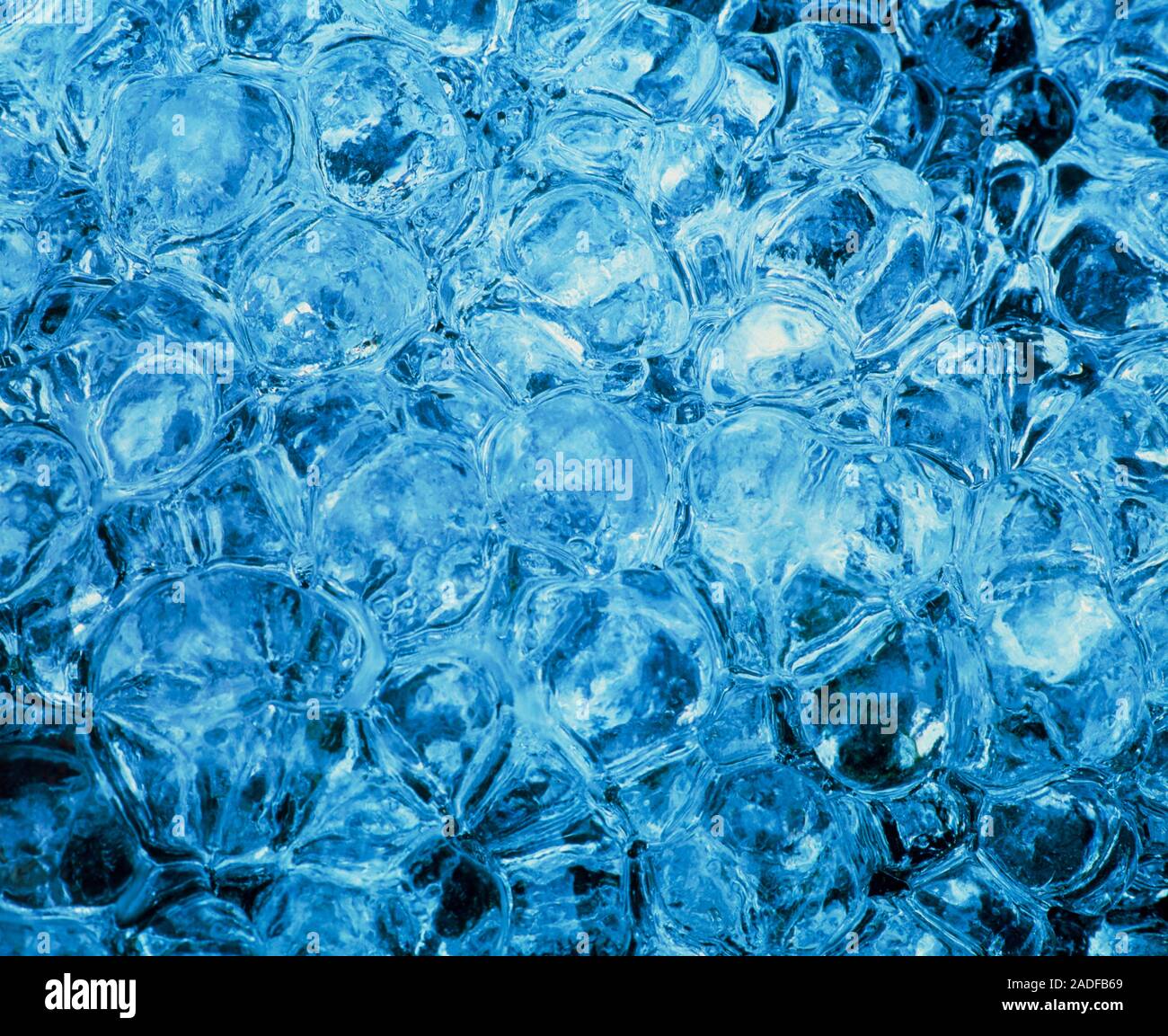 Ice formed from a waterfall splashing onto a boulder Stock Photo - Alamy
