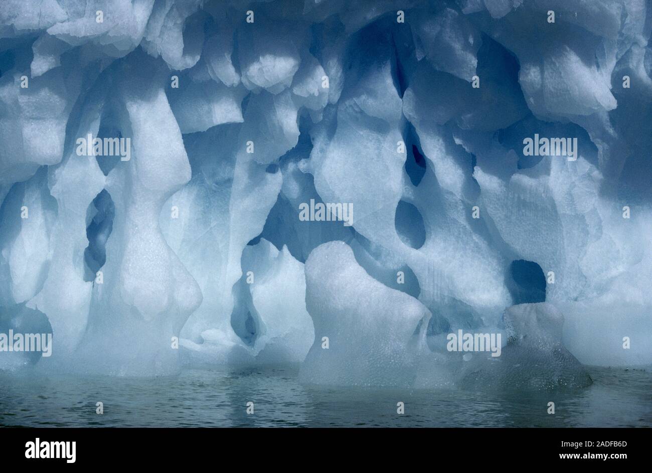 Sculptured ice. The side of an iceberg weathered by the action of sea ...