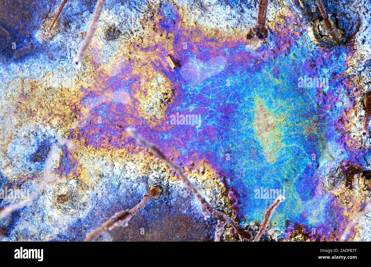 Interference patterns in a frozen pond. containing thin films of oil ...