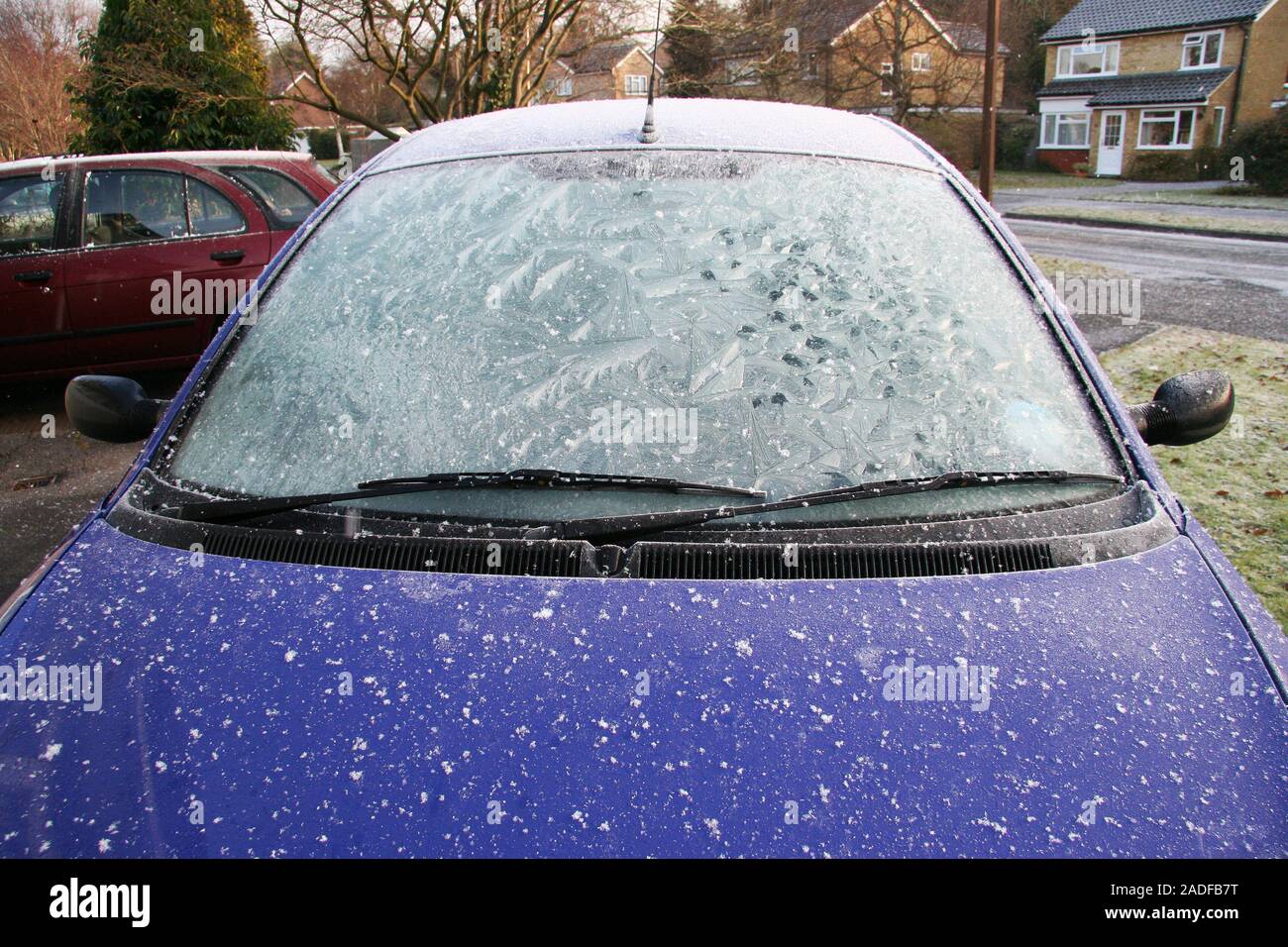 Iced-up car windscreen. The ice formed overnight as temperatures ...