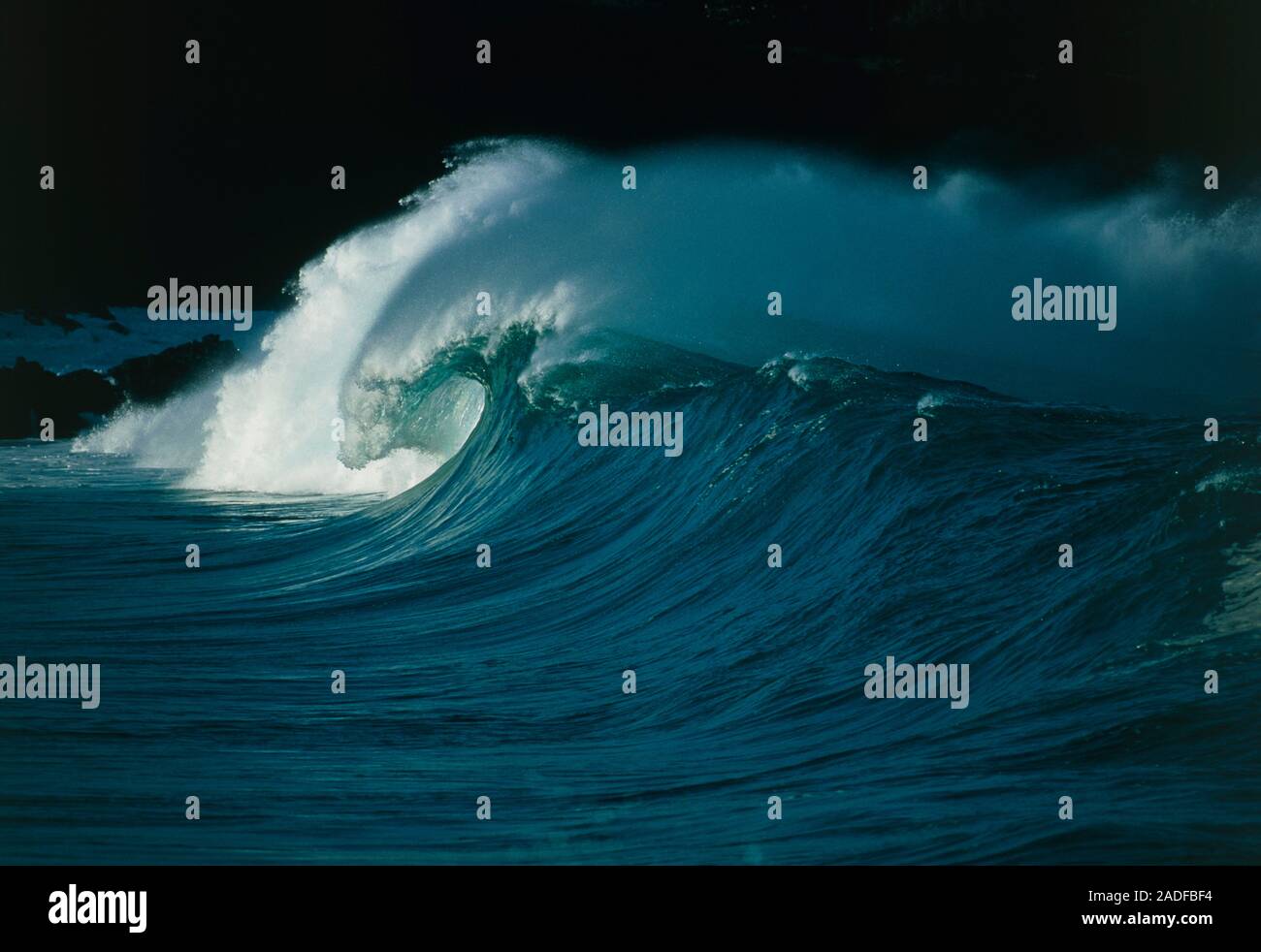 Breaking wave. View of a wind-blown wave (comber) breaking as it nears ...